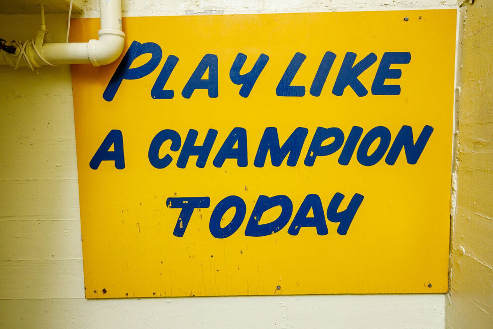 'Play Like a Champion Today' Sign Slap
