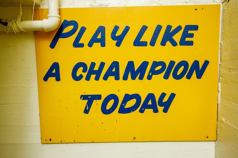 'Play Like a Champion Today' Sign Slap
